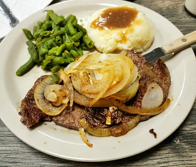 This is what happens when liver and onions get the respect they deserve – pure, caramelized magic.