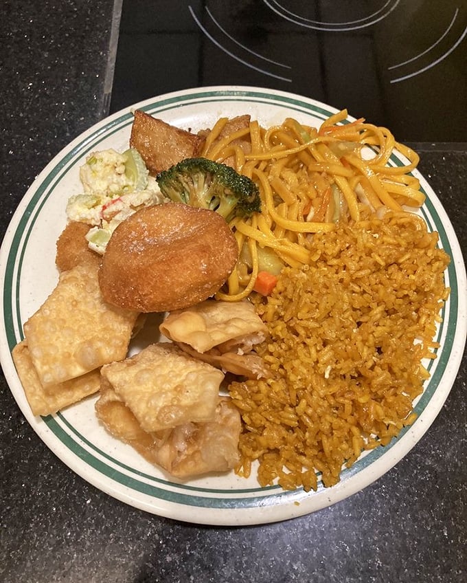A plate that tells the story of buffet strategy – crab rangoon as the opening act, lo mein as the headliner, and fried rice as the reliable backup singer.