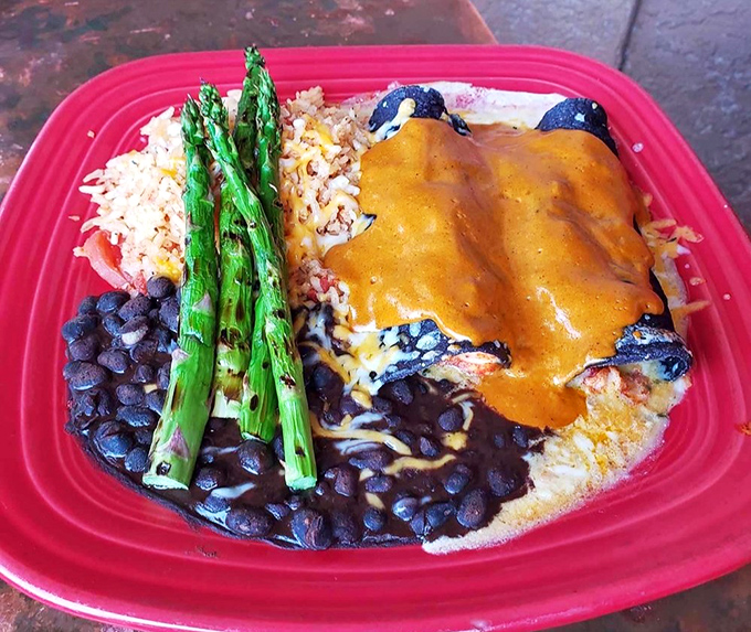 Behold the star attraction: lobster enchiladas that make you question why you've been eating regular enchiladas your whole life. The asparagus adds color and the pretense of healthiness.