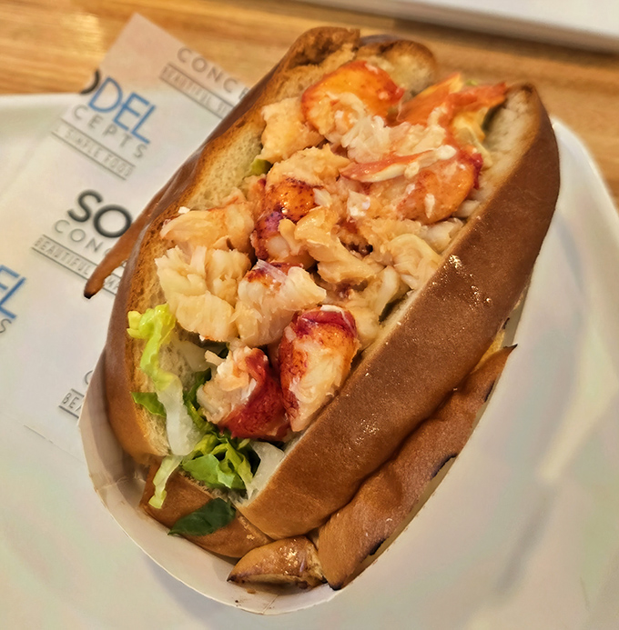 The legendary lobster roll—where chunks of sweet meat nestle in a perfectly toasted bun like they've finally found their forever home.