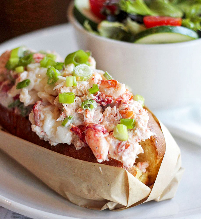 This isn't just a lobster roll; it's summer vacation on a toasted bun—chunks of sweet meat mingling with just enough mayo to make memories.