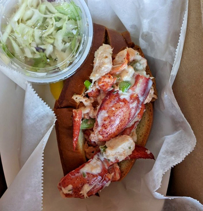 This isn't just a lobster roll—it's a masterclass in simplicity. Sweet chunks of Maine lobster nestled in a toasted bun with zero pretension.