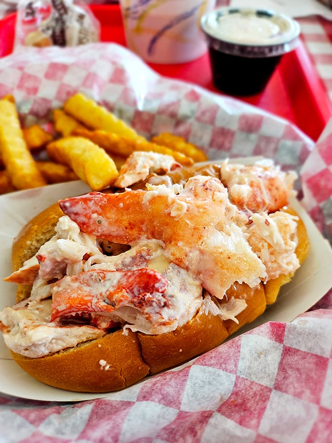 This isn't just a lobster roll—it's a masterpiece of simplicity. Sweet chunks of lobster meat practically spilling out of that perfectly toasted bun.
