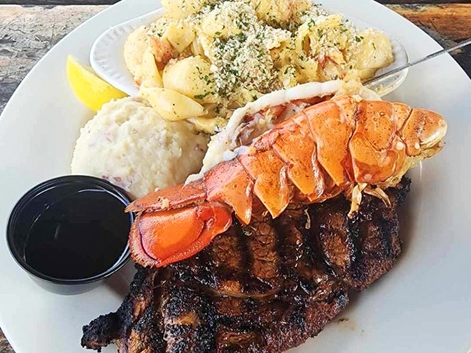 Surf meets turf in perfect harmony. That lobster tail isn't just dinner—it's the exclamation point on a plate of pure Florida joy.