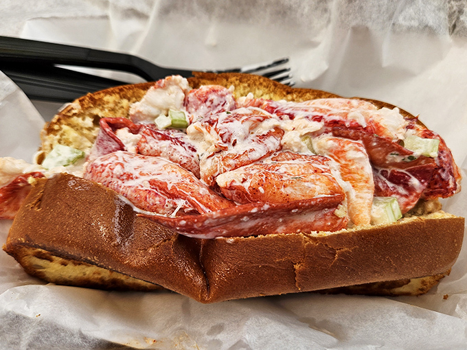 Not all heroes wear capes—some come on toasted split-top buns. This Maine lobster roll has more chunks than a chocolate factory.