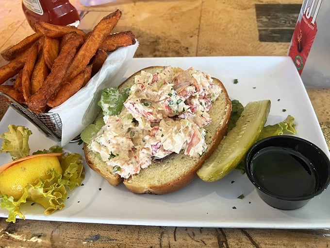 The Maine event: chunks of sweet lobster meat nestled in a perfectly toasted roll. This isn't just lunch—it's a religious experience with a side of crispy fries.