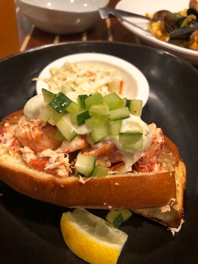 Not just a lobster roll, but a work of art. The cucumber garnish adds a fresh crunch that cuts through the richness—like nature's palate cleanser.