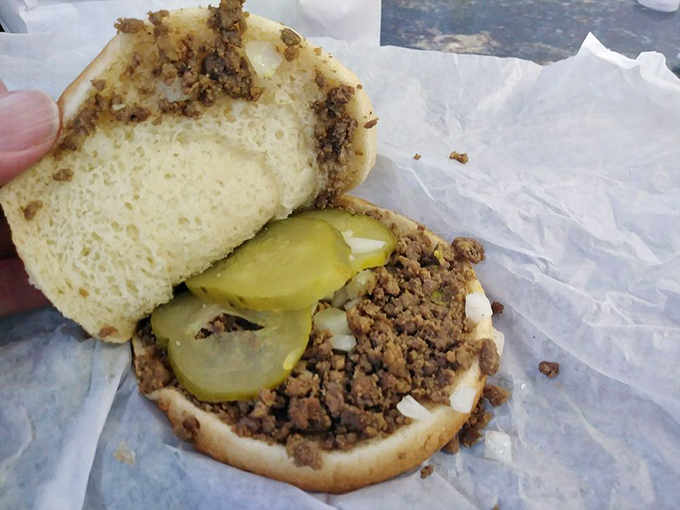 The legendary loose meat sandwich in all its humble glory—seasoned ground beef, pickles, and onions on a pillowy bun. Simplicity that defies imitation.