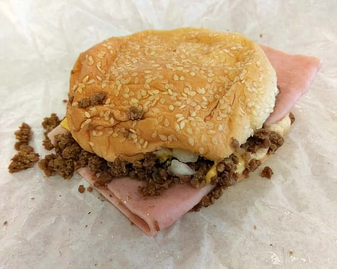 Not a sloppy joe, not quite a burger – this loose meat masterpiece exists in its own delicious dimension of sandwich artistry.