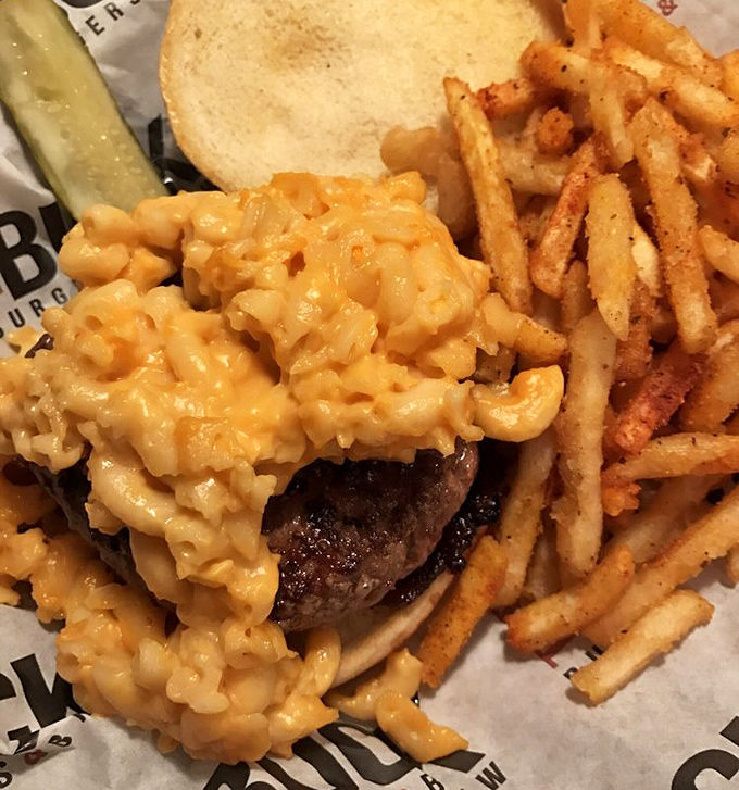 Mac and cheese that doesn't just sit on a burger—it crowns it like cheesy royalty. The ultimate comfort food power couple.