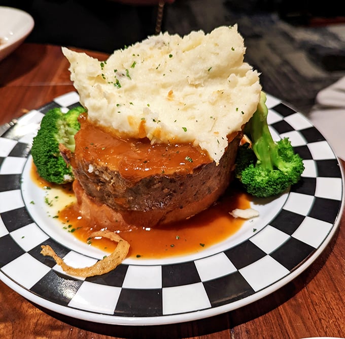 Behold the meatloaf monument—where comfort food gets dressed up for the opera but still remembers where it came from.