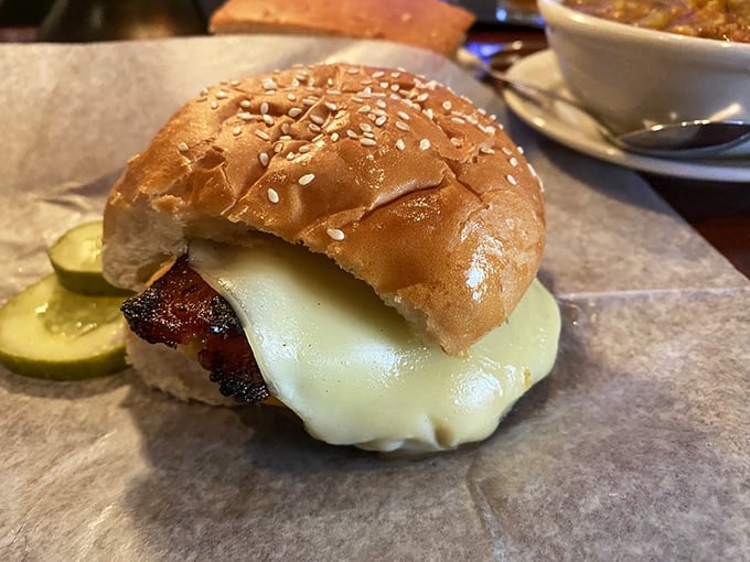 The Melting Pot burger doesn't just have cheese—it surrenders to it. That golden cascade of Wisconsin's finest makes resistance utterly futile.