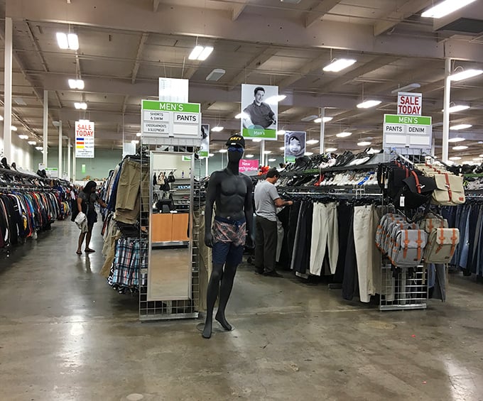 Men's fashion democracy in action—where vintage band tees and office-ready slacks coexist peacefully under the watchful gaze of bygone style icons.