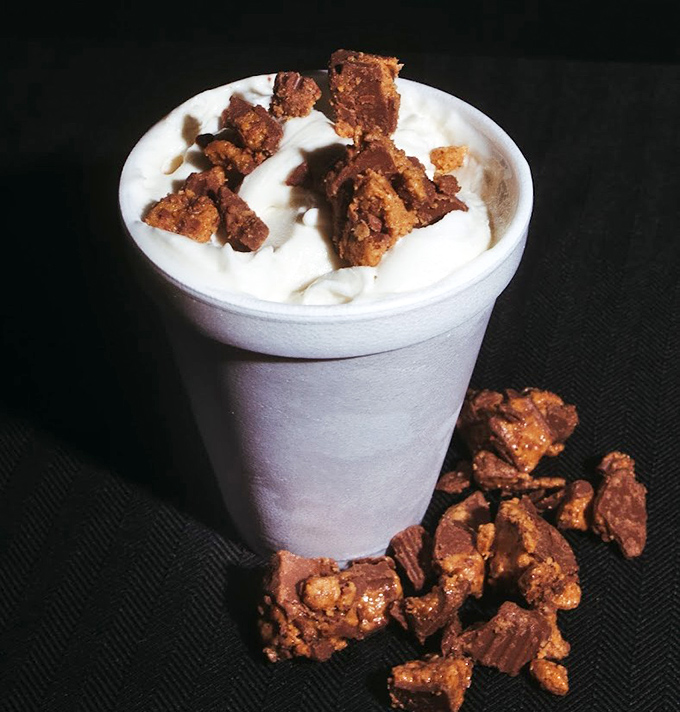 Not just a milkshake, but a religious experience topped with what appears to be crumbled peanut butter cups. Spoon required, no sharing advised.