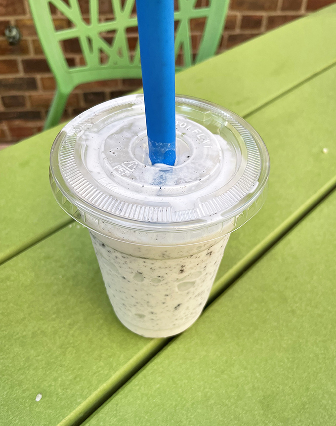This isn't just a milkshake—it's summer vacation in a cup, complete with the blue straw of happiness. Cookies and cream never had it so good.