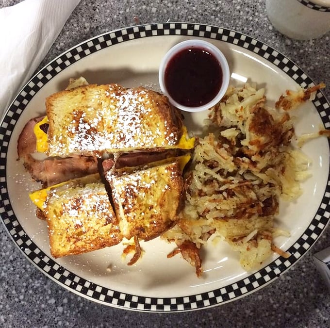 The Monte Cristo: where breakfast and lunch have a delicious identity crisis. That powdered sugar dusting isn't just garnish—it's essential magic.