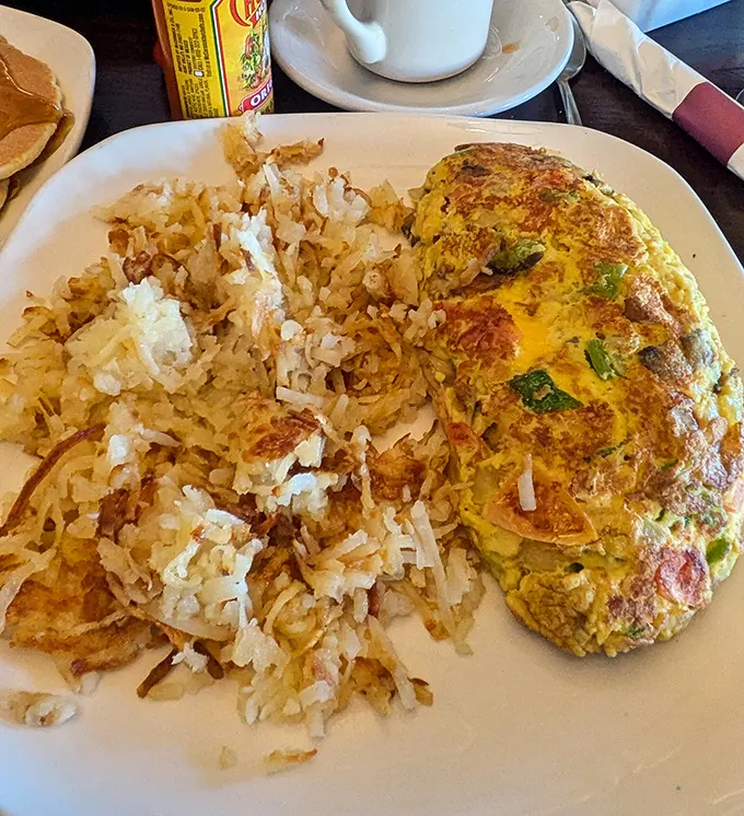 This isn't just an omelet; it's a fluffy golden masterpiece that makes you question why you ever cook eggs at home.