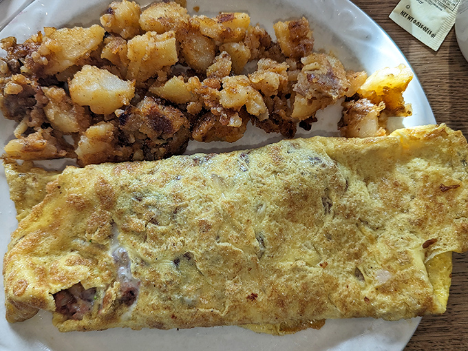 This Western omelet and home fries combo is the breakfast equivalent of a warm hug from your favorite aunt – familiar, comforting, and exactly what you needed.