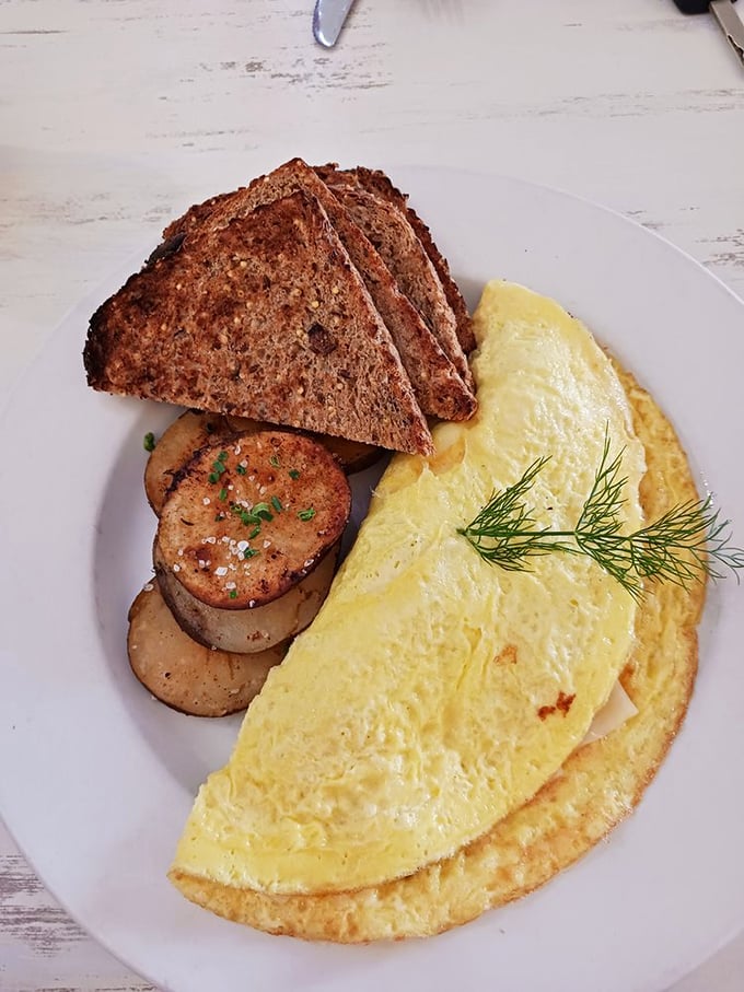 Fluffy perfection meets savory satisfaction in this golden omelet that could make angels weep with joy.