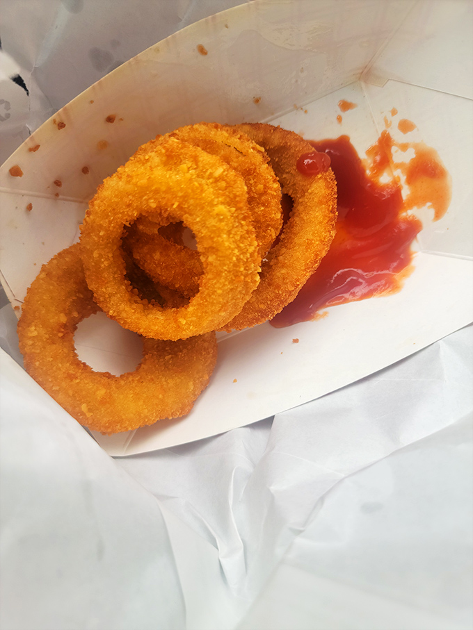 These onion rings aren't just side dishes—they're golden halos of happiness, crispy enough to make even the most dedicated chicken fan temporarily switch allegiances.