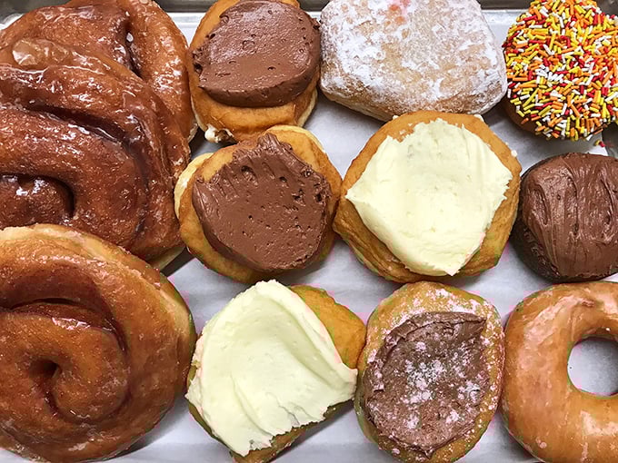 Donut democracy in action: from cream-filled to cinnamon-swirled, everyone finds their perfect match in this box of handcrafted happiness.