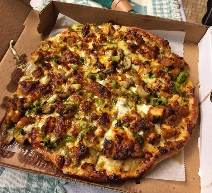 This isn't just pizza—it's edible real estate where every inch is prime property. Chicken, green peppers, and cheese living in delicious harmony.