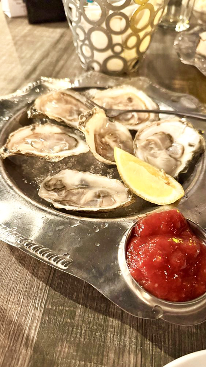 Fresh oysters on ice—nature's perfect appetizer. That tiny squeeze of lemon is all these briny treasures need before they slide down like silky ocean kisses.