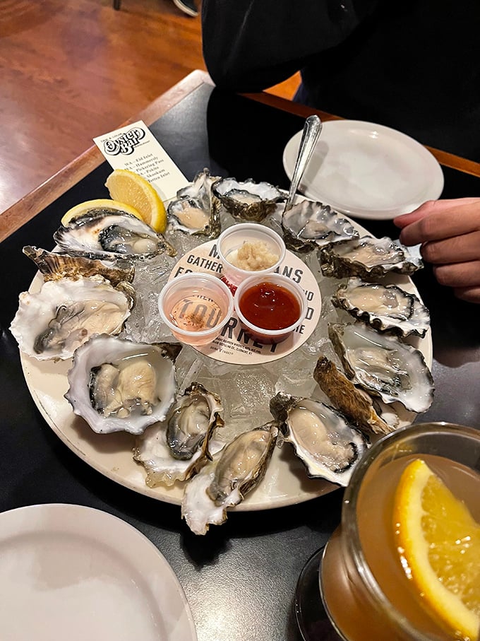 These oysters aren't just served—they're presented like the treasures they are. Fresh, briny perfection on ice with classic accompaniments.