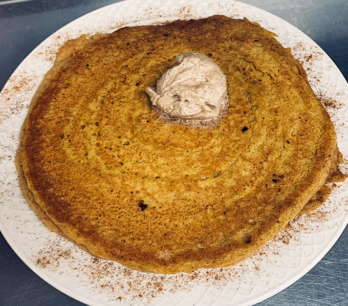 This cinnamon-dusted pancake with whipped butter isn't just breakfast—it's edible therapy that costs less than a session with your therapist.