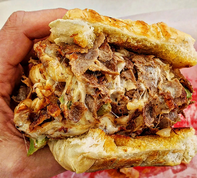 This isn't just a Philly cheesesteak; it's a masterclass in balance—tender meat, melted cheese, and bread that knows its supporting role.