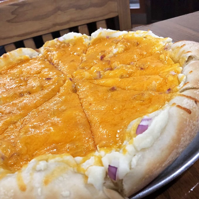 This cheese-laden pizza isn't just food—it's an edible hug with a golden crust and melty goodness that whispers, "Diet? What diet?"
