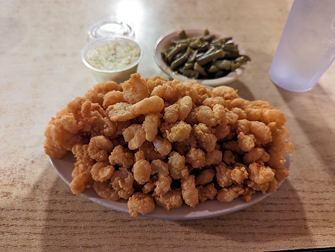 Golden treasure in edible form! These popcorn shrimp aren't just fried, they're transformed into bite-sized morsels of seafood perfection.