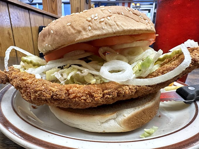 The breaded tenderloin sandwich: Indiana's edible license plate. It's a beautiful geometry problem—a circle of crispy pork trying to make peace with its square bun.