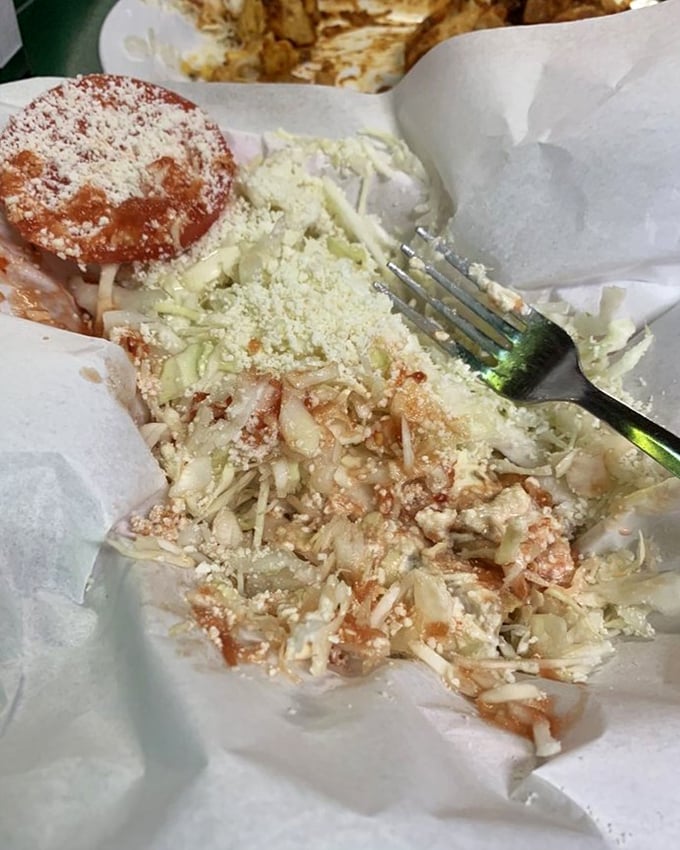 Behold the famous potato taco in all its glory – a crispy shell embracing seasoned mashed potatoes, showered with cheese that's melting into delicious submission.