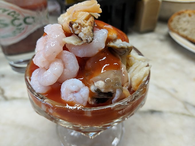 Seafood cocktail perfection – plump prawns and tender crab nestled in tangy sauce. The kind of dish that makes conversation stop and eyes close in appreciation.