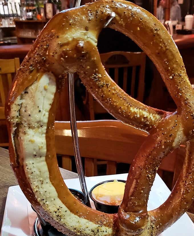 The pretzel that launched a thousand cravings—golden, twisted perfection with beer cheese that'll haunt your dreams.