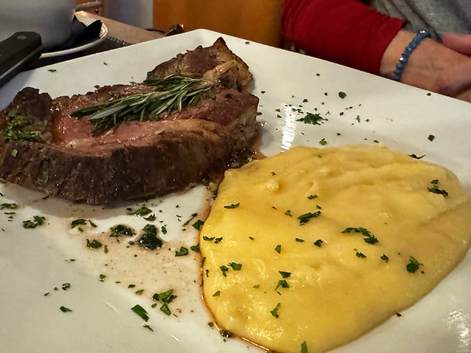 The prime rib that launched a thousand road trips. That rosemary sprig isn't garnish—it's a victory flag claiming steak supremacy.
