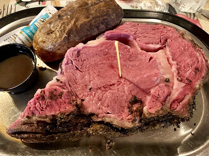 Behold the star of the show—prime rib so perfectly pink it practically glows, with a seasoned exterior that whispers of patience and tradition.
