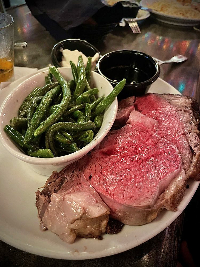 This prime rib isn't just dinner; it's a religious experience. That perfect pink center surrounded by a seasoned crust is what dreams are made of.