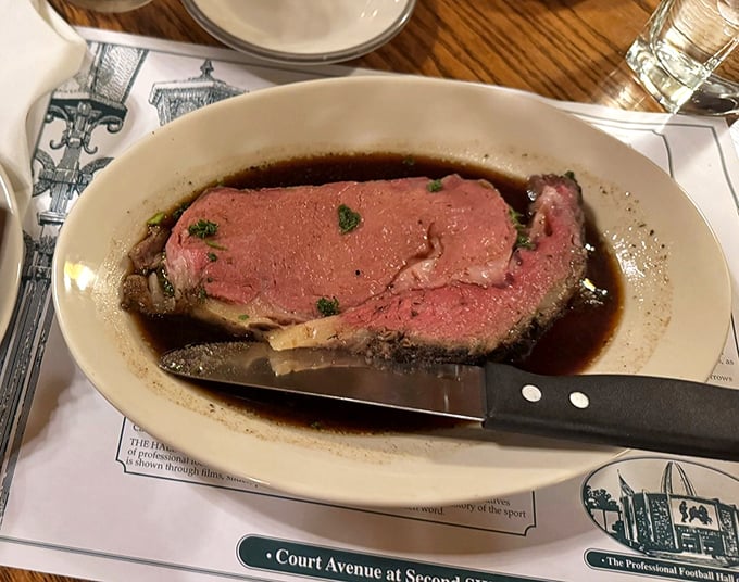 The prime rib arrives like a carnivore's dream—perfectly pink, swimming in savory jus. This isn't dinner; it's a religious experience with a knife and fork.