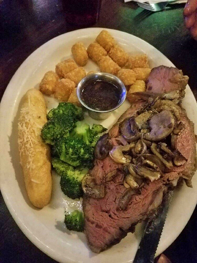 Behold the star of the show: prime rib so perfectly cooked it makes vegetarians question their life choices. Those mushrooms aren't just garnish—they're supporting actors deserving their own award.