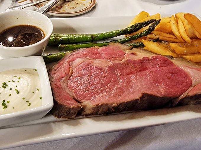 This prime rib doesn't just steal the show – it buys the theater. Perfectly pink, accompanied by asparagus and au jus for a classic steakhouse trifecta.