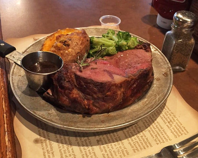 Behold the star attraction! This prime rib arrives like royalty—perfectly pink, accompanied by a golden baked potato and vibrant broccoli. The au jus is liquid gold.