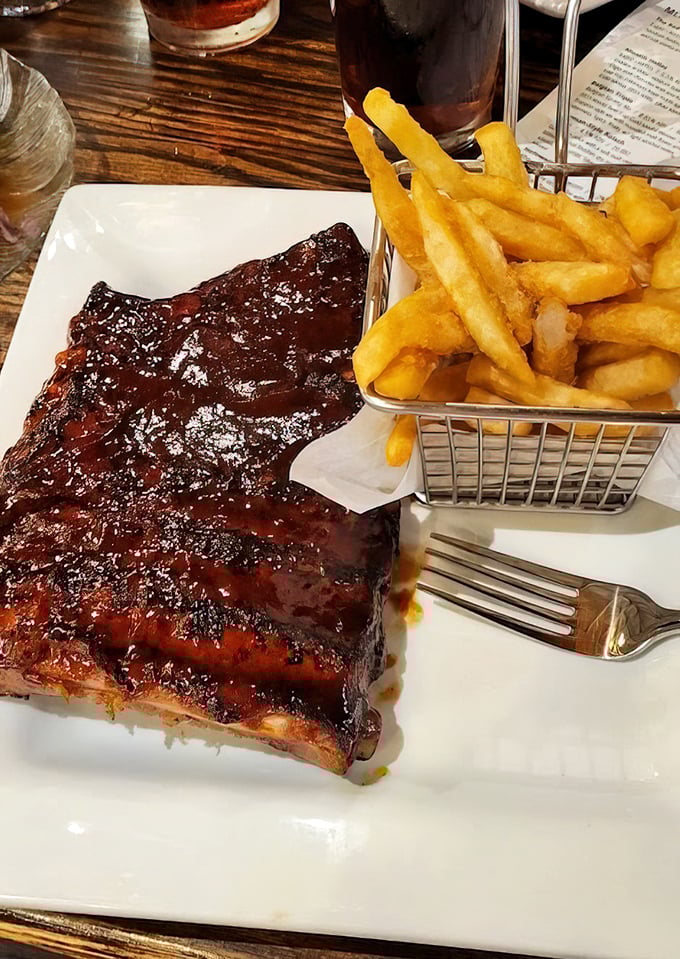 These ribs aren't just falling off the bone—they're practically jumping onto your fork, begging to be introduced to your taste buds.