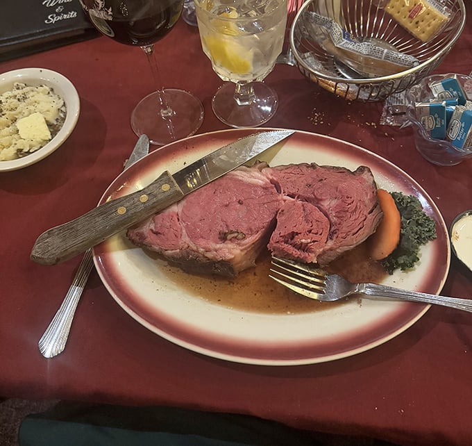 Prime rib so perfectly pink it should have its own Instagram account. That knife isn't just a utensil – it's a magic wand.