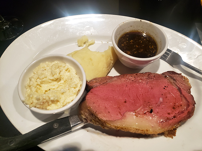 Behold the star of the show—prime rib so perfectly pink it should have its own Instagram account, accompanied by sides that know their supporting role.