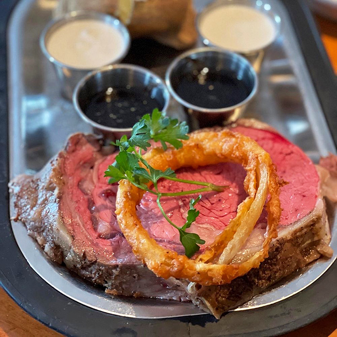 Prime rib that makes you close your eyes involuntarily with that first bite – crowned with a crispy onion ring like a beefy royal wearing its delicious crown.
