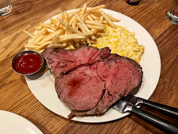 This isn't just prime rib—it's edible poetry. Perfectly pink, impossibly tender, accompanied by creamed corn and fries that aren't afterthoughts.
