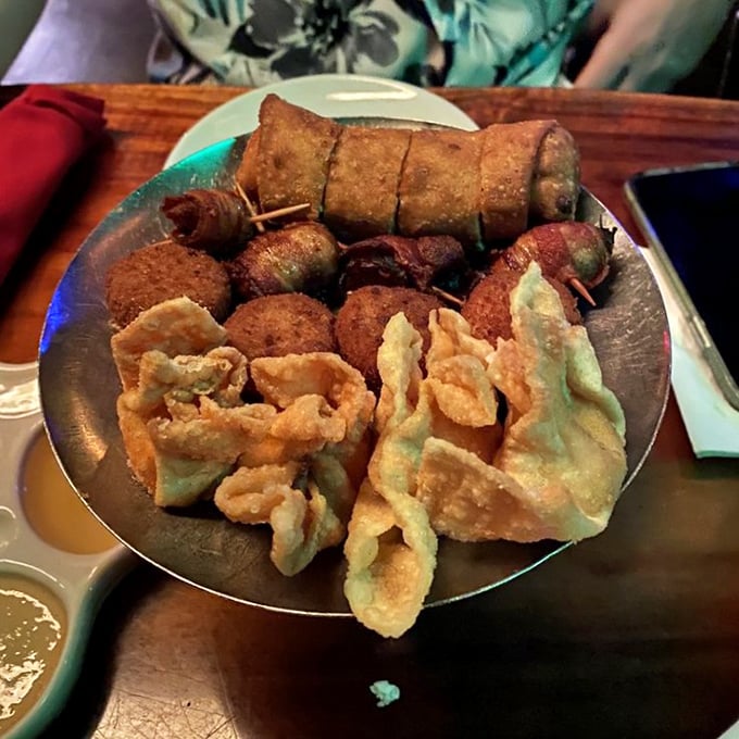 The Pupu Platter arrives like a greatest hits album of appetizers. One bite and you'll understand why sharing food was invented—and why it's overrated.
