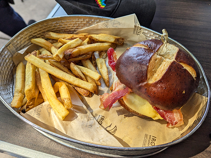 This isn't just a burger—it's architecture with flavor, where pretzel bun meets bacon in perfect harmony.